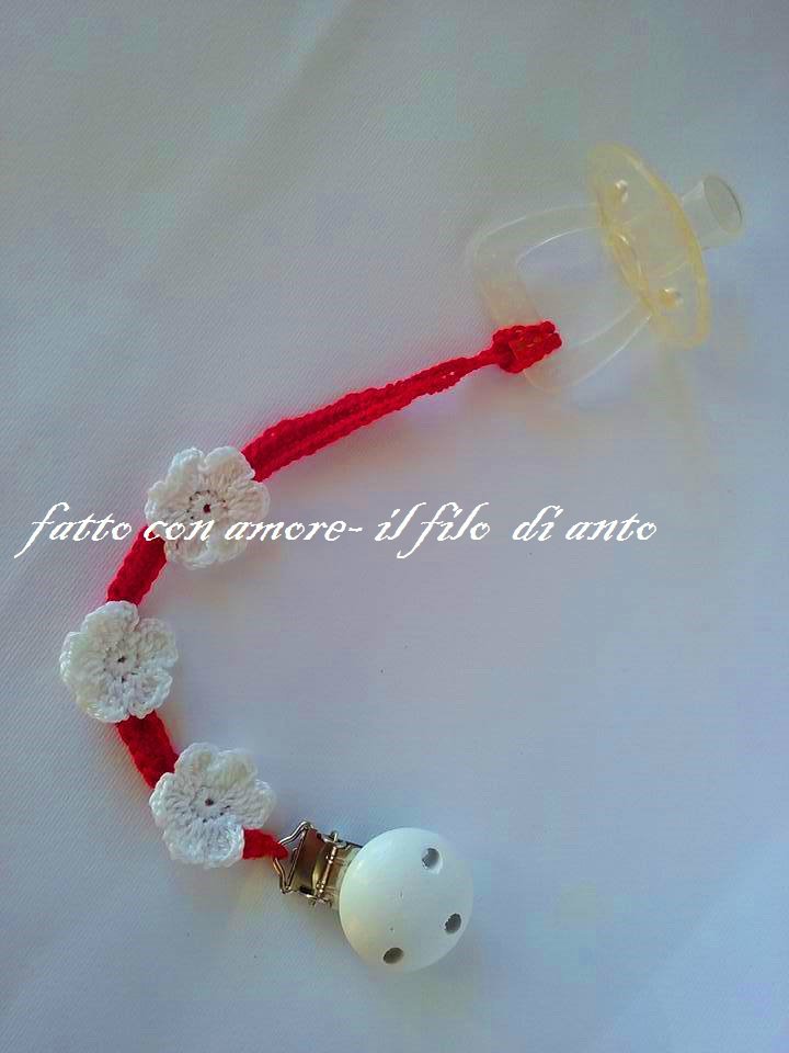 Catenella porta ciuccio rosso con fiori bianchi - Bambini - Accesso ...